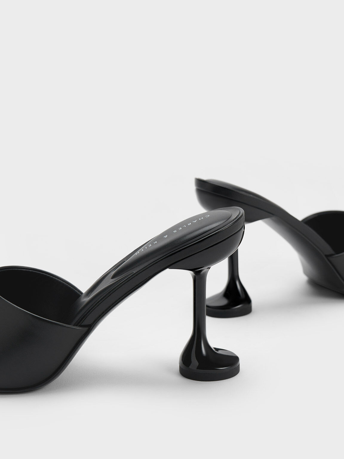 Black Celestine Sculptural Heel Mules Charles And Keith Qa