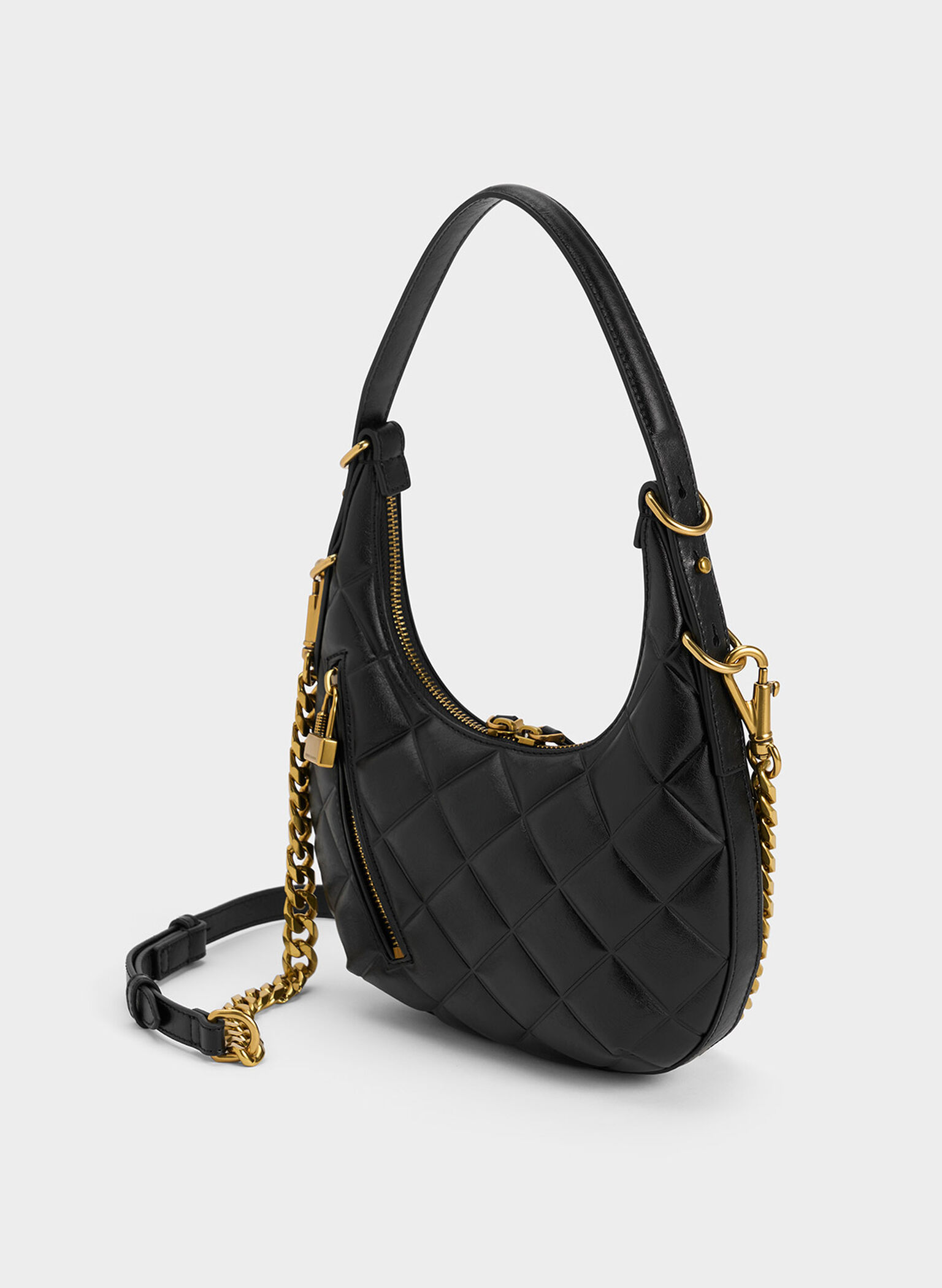 Black Swing Padlock Quilted Crescent Bag Charles And Keith Om