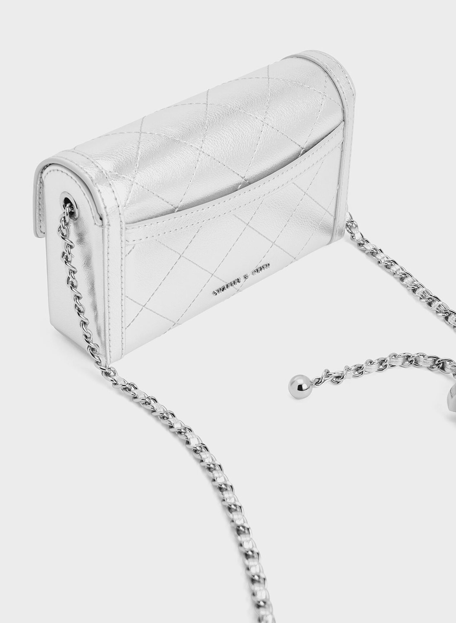 Silver Tallulah Quilted Metallic Push-Lock Clutch - CHARLES & KEITH BH