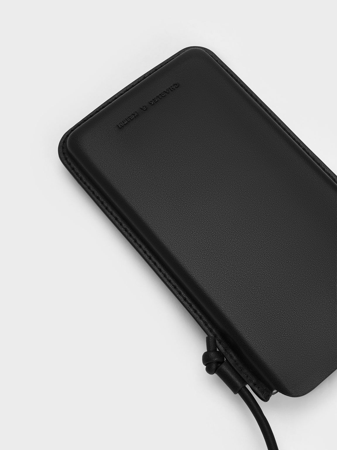 Black Camelia Phone Pouch - CHARLES & KEITH MX