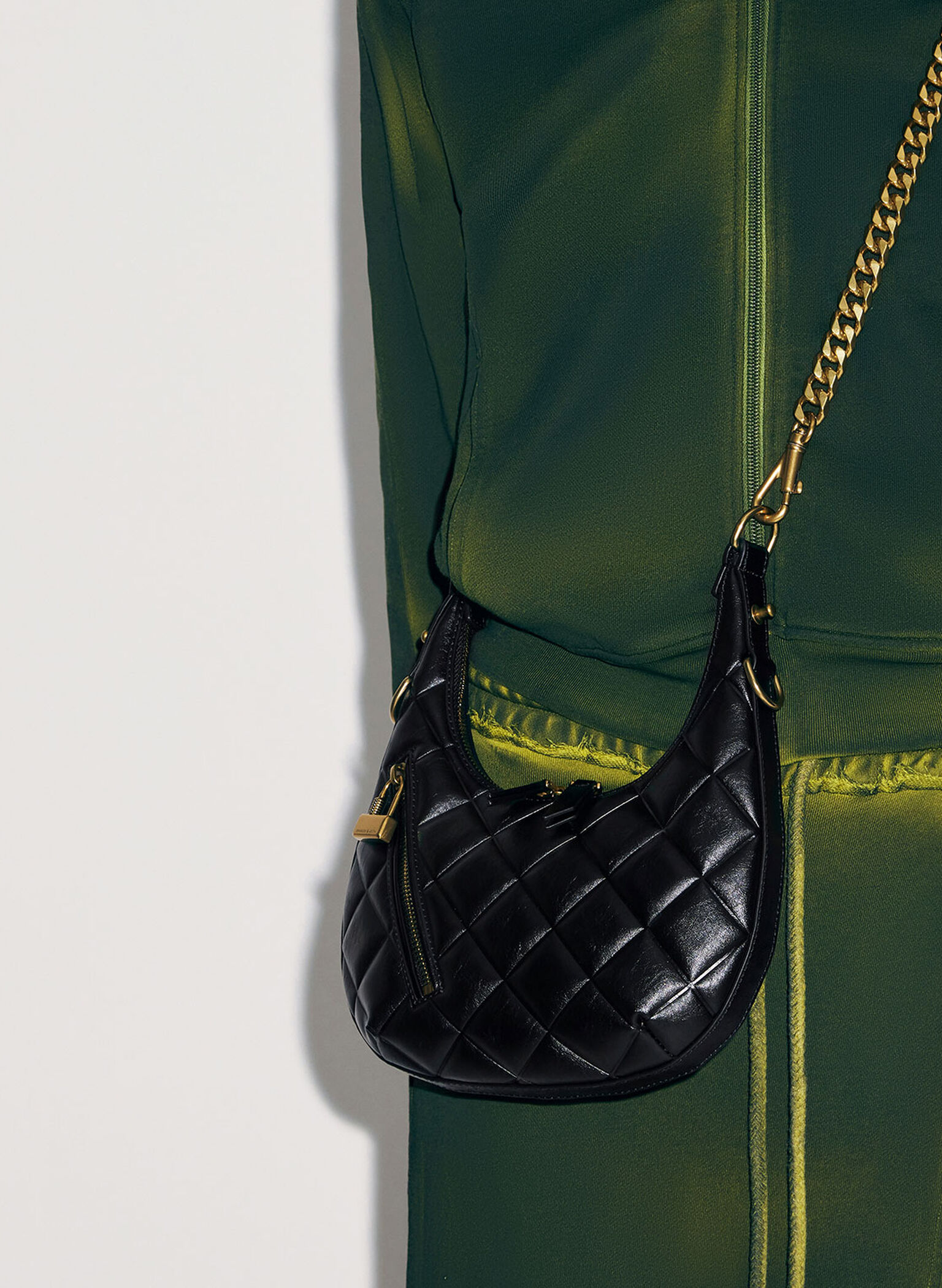 Black Swing Padlock Quilted Crescent Bag Charles And Keith Om